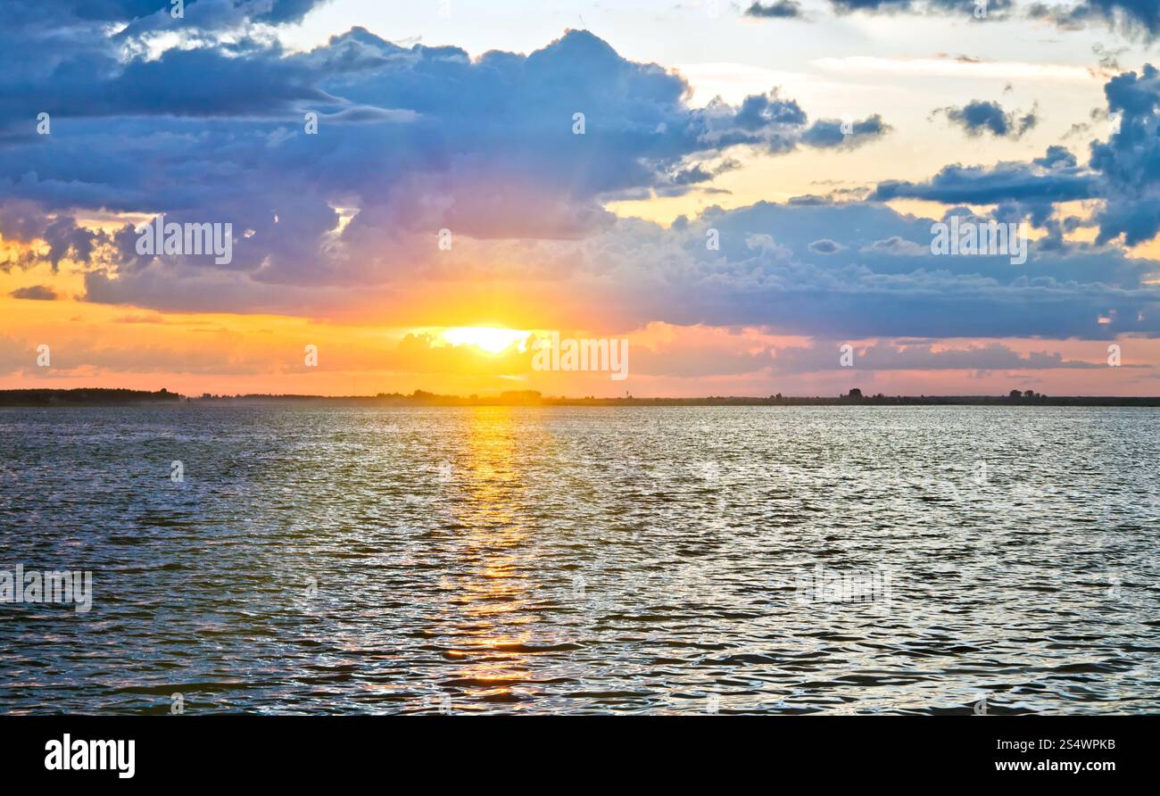 Lake sunset view with sunlight path. Two shots stitch image Stock Photo ...