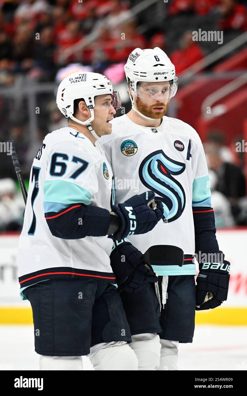 Seattle Kraken center Mitchell Stephens, left, and defenseman Adam ...