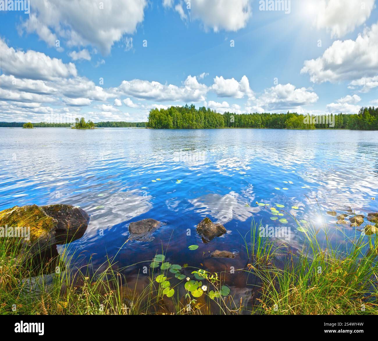 Lake Rutajarvi summer view with reflection of clouds on water surface ...