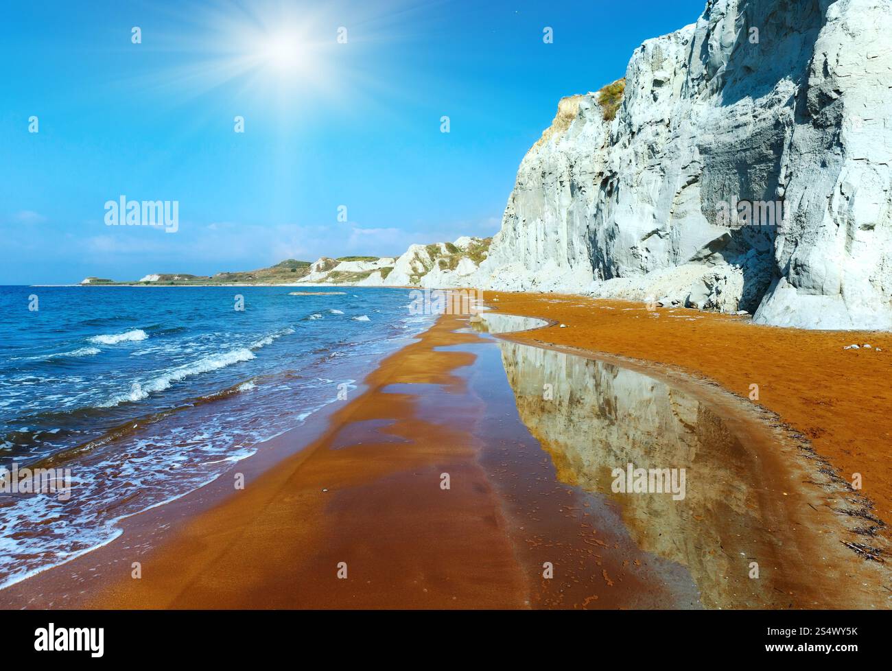 Xi beach with red sand morning view with sunshine greece hi-res stock ...