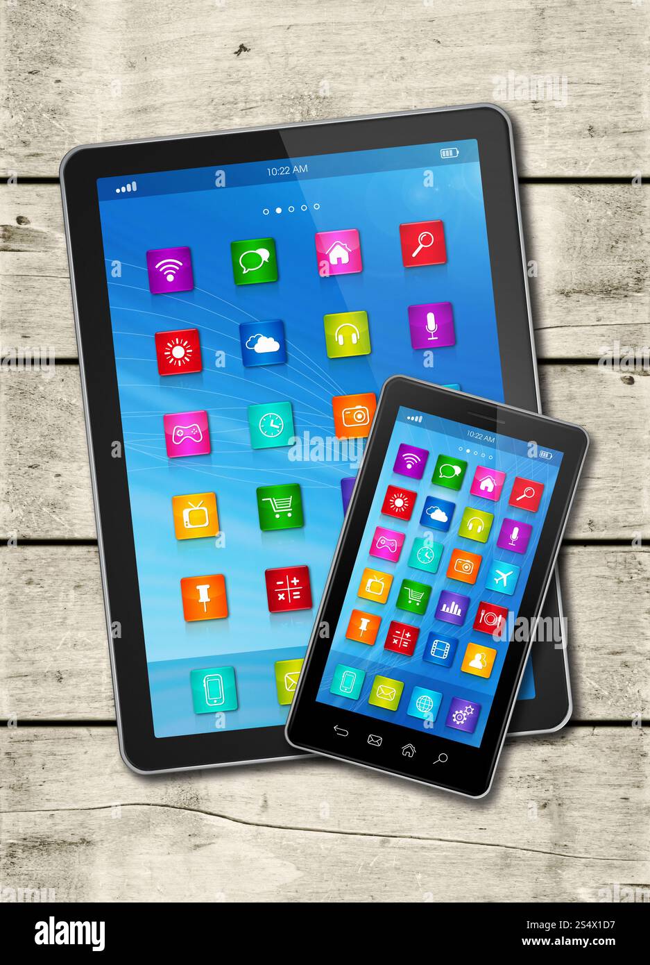 Smartphone and digital tablet PC with desktop icons on a white wood ...