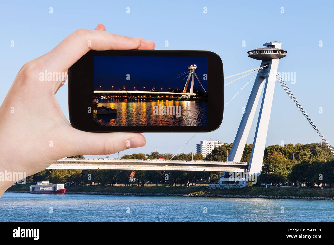 travel concept - tourist snapshot of SNP Bridge (UFO bridge, Novy Most ...