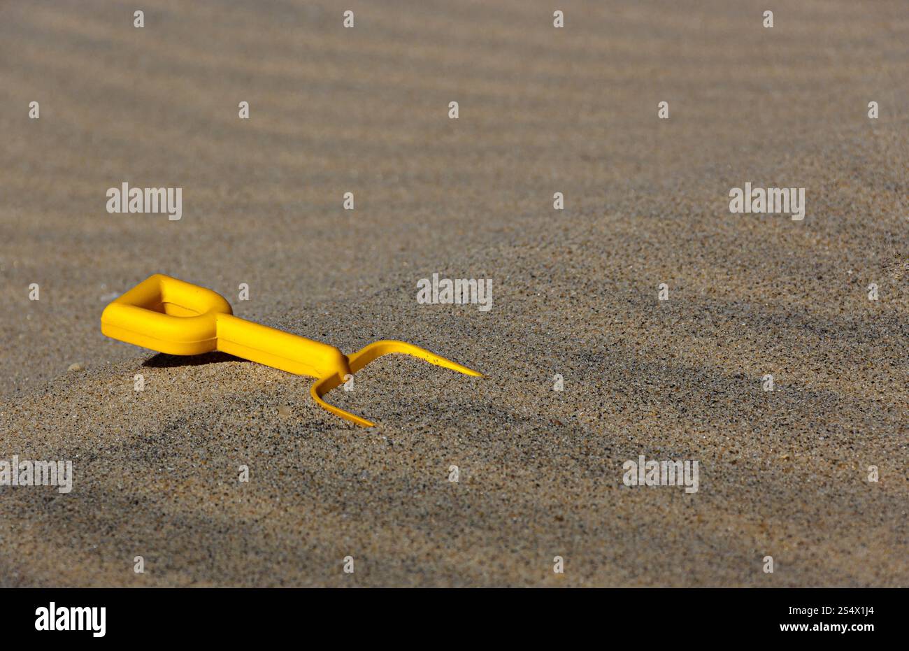 A childs shovel will bring you back to your childhood and summers at the beach. A yellow plastic ...
