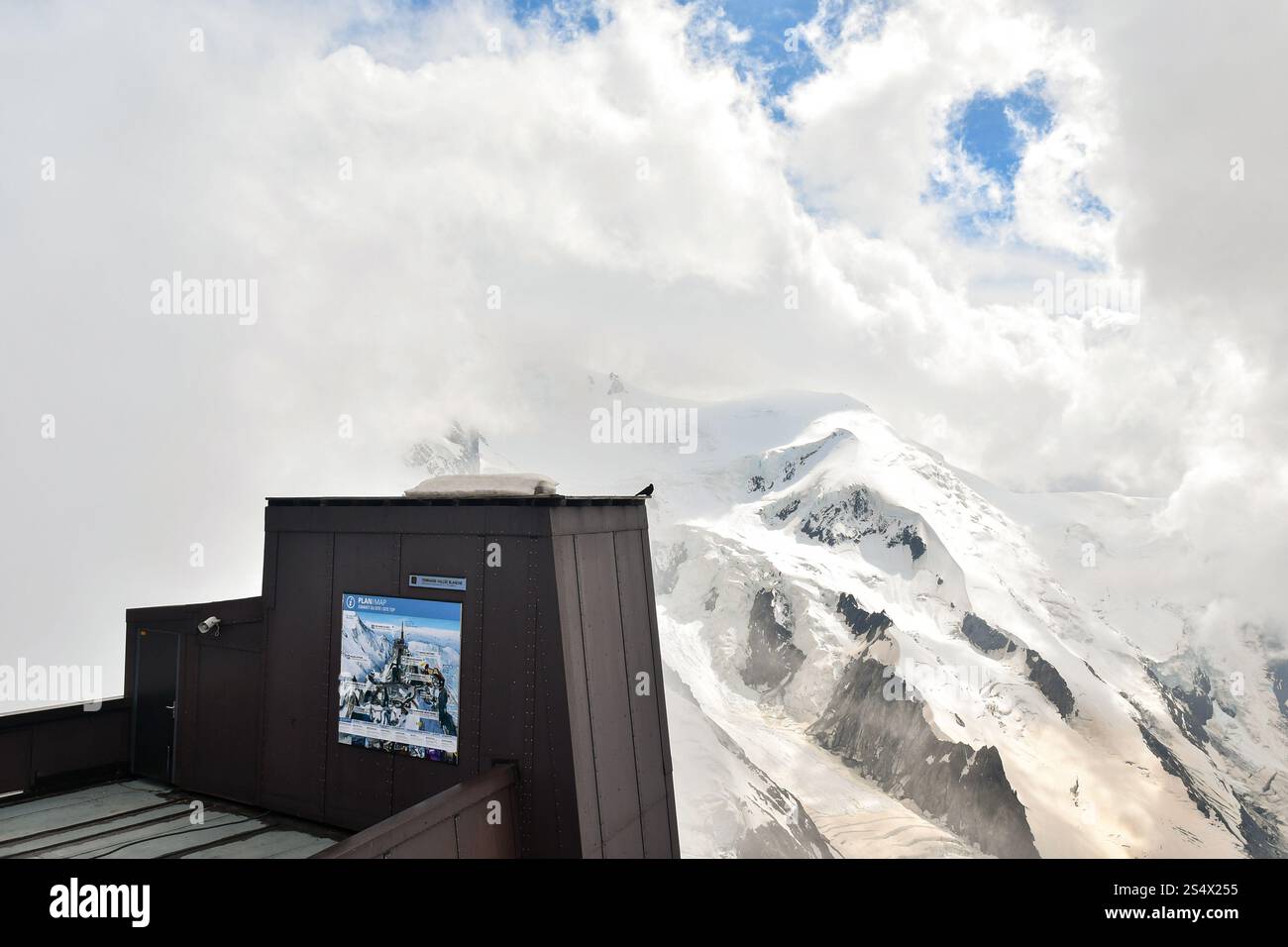 A terrace of the Aiguille du Midi (3842 m), with a map of the cable car ...