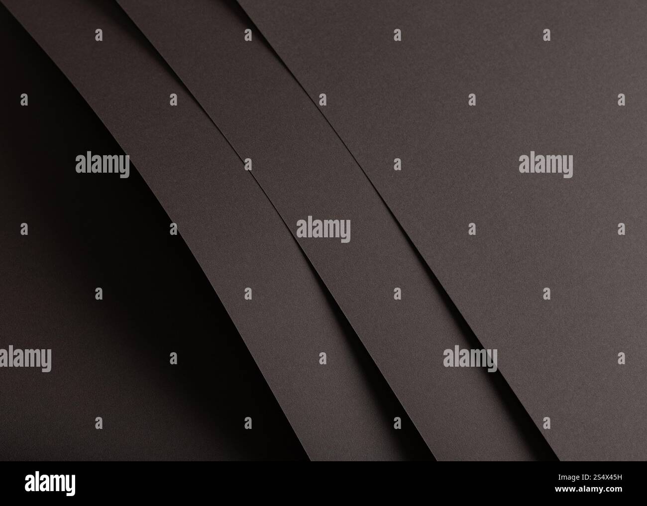 Charcoal gray paper background with matte, overlapping layers and ...