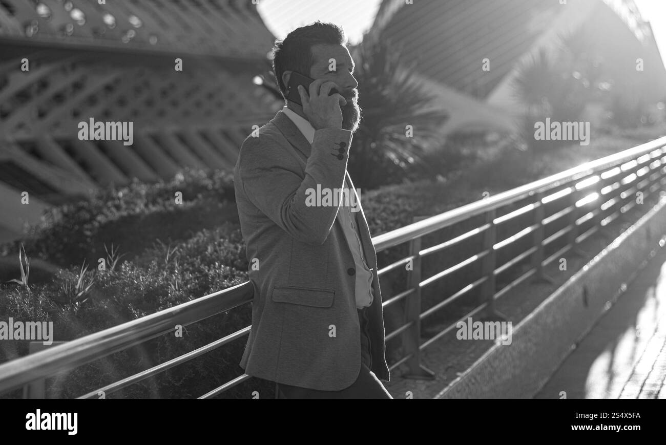 Confident businessman mobile phone Black and White Stock Photos ...