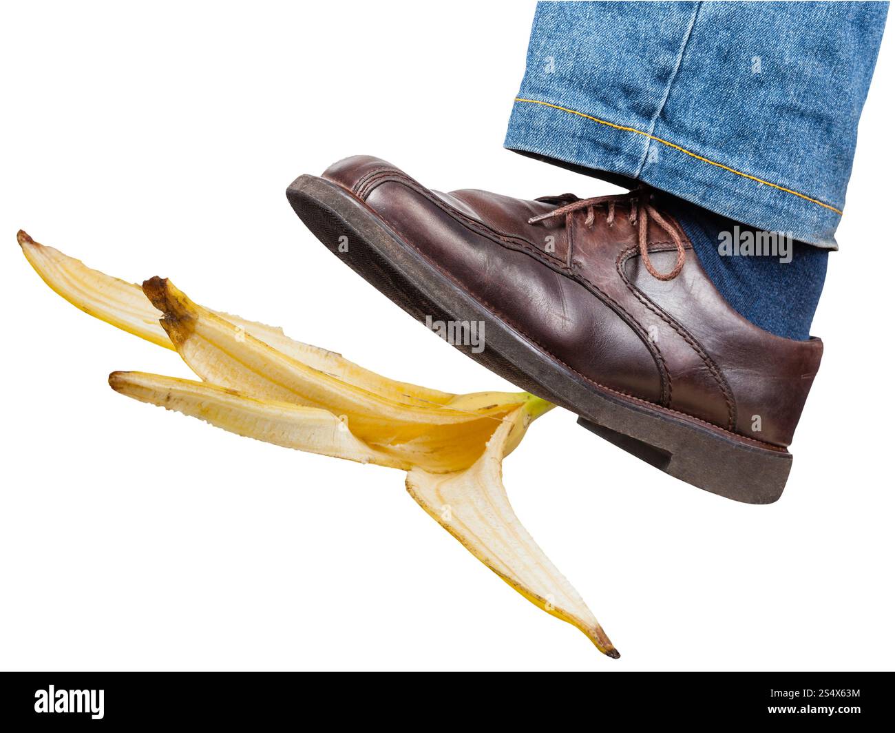 male left leg in jeans and brown shoe slips on a banana peel isolated ...