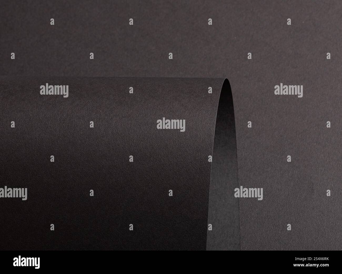 Jet black paper background with a matte, grainy texture and subtle ...