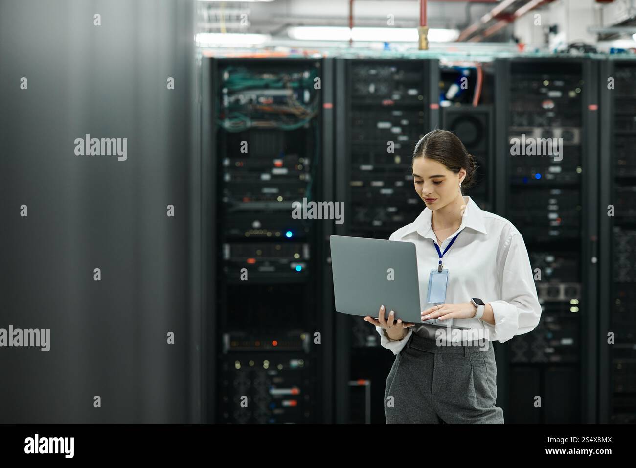 Woman in a white shirt collaborates with network systems in a ...