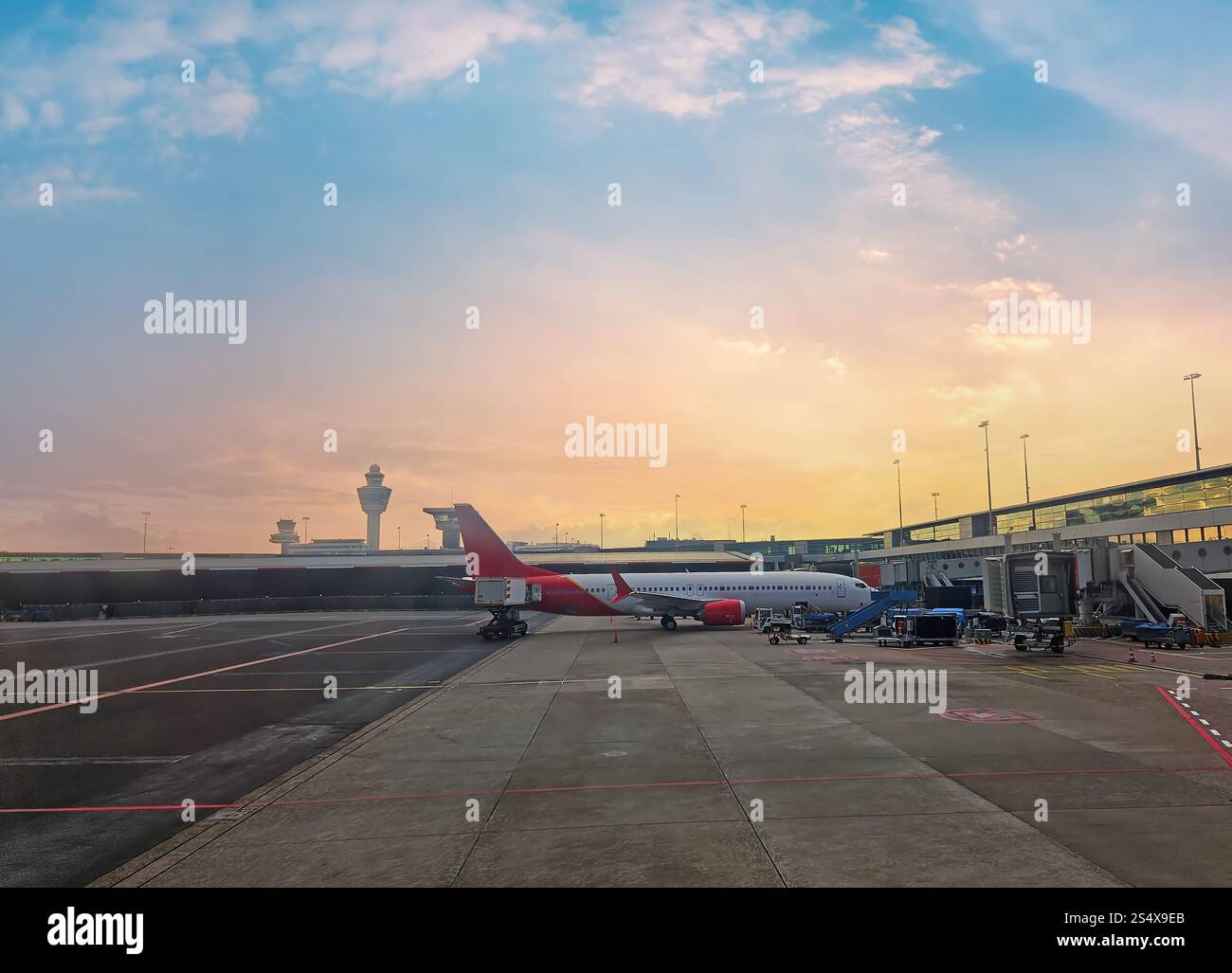Airplane standing at the gate on Schiphol airport in the Netherlands ...