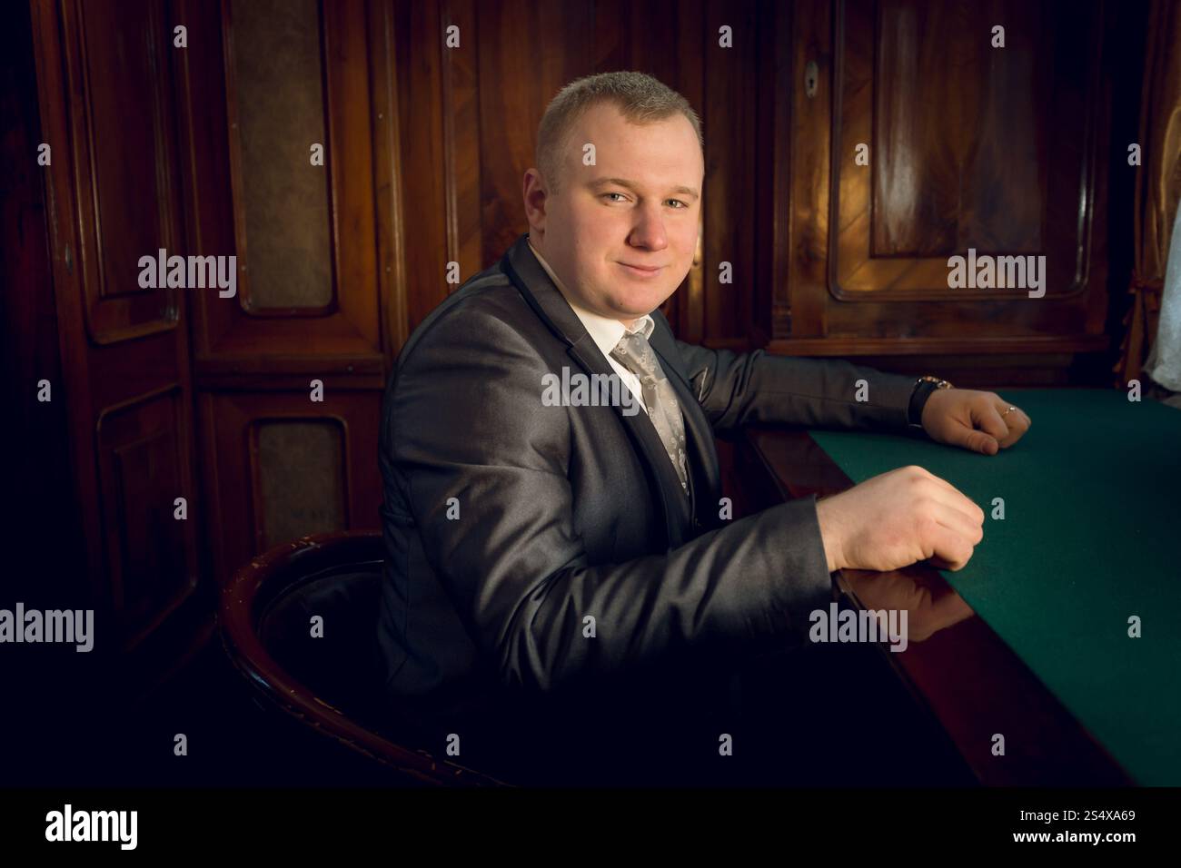 Portrait of man in vintage suit posing in banker office Stock Photo - Alamy