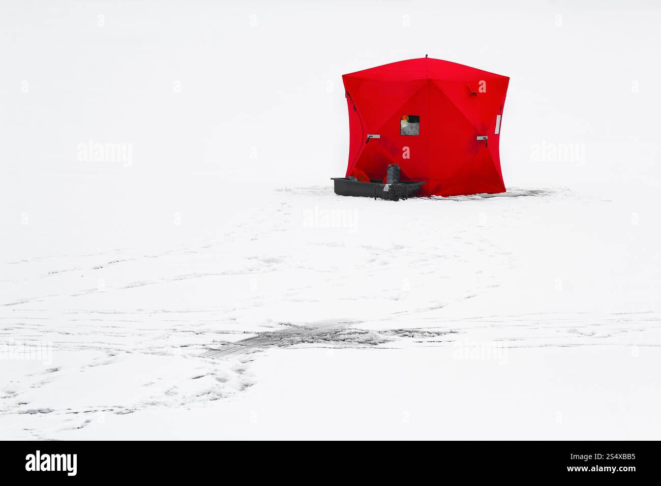 Ice fishing shelter or tent on a frozen lake Stock Photo - Alamy