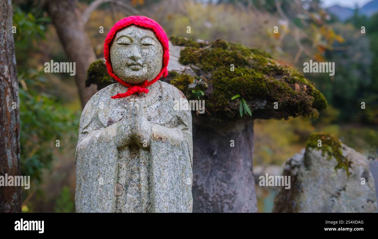 Jizo Bodhisattva (O-Jizo-sama) statue on the roadside of a small ...