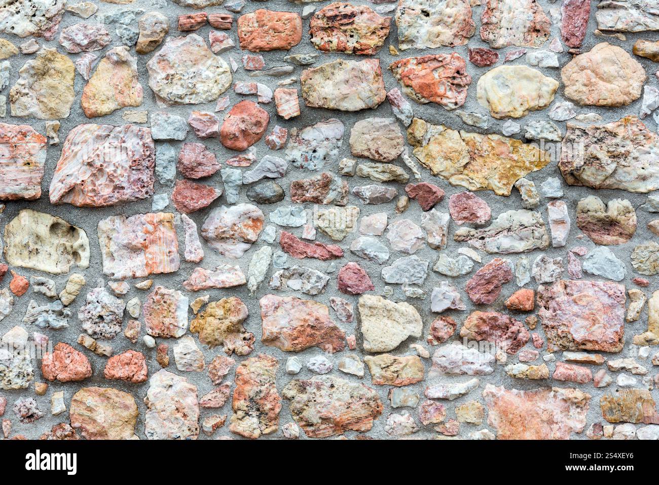 Stony wall from big cobblestones close up, background Stock Photo - Alamy