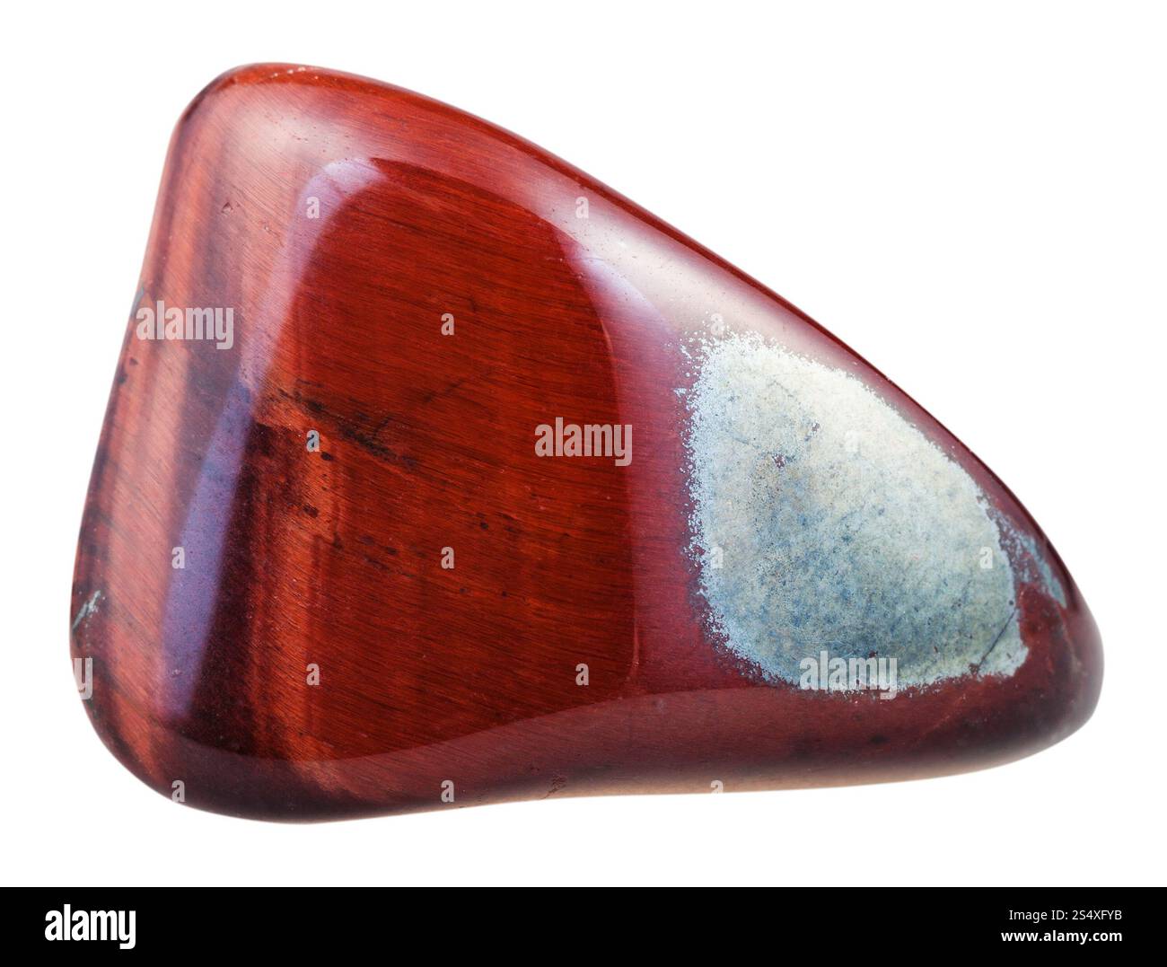 macro shooting of natural mineral stone - tumbled red ox-eye gemstone ...