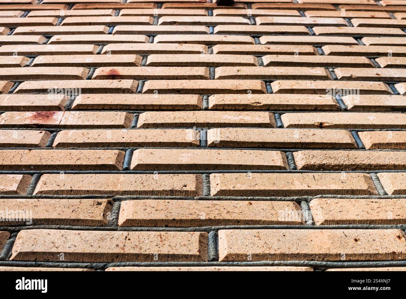 construction background - bottom view of wall from finishing bricks ...