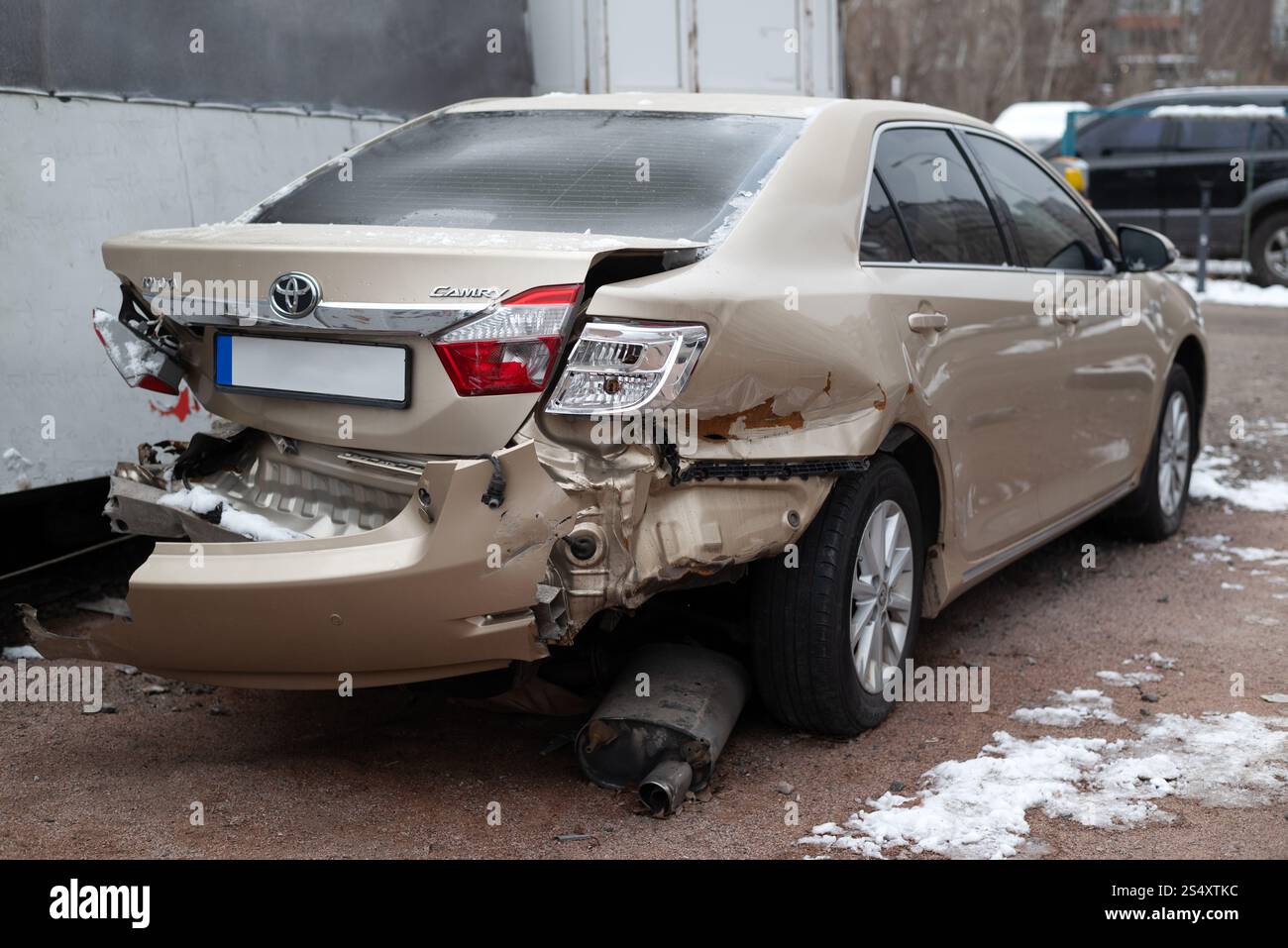 Kyiv, Ukraine, January 13, 2025. Damaged beige Toyota Camry with a ...