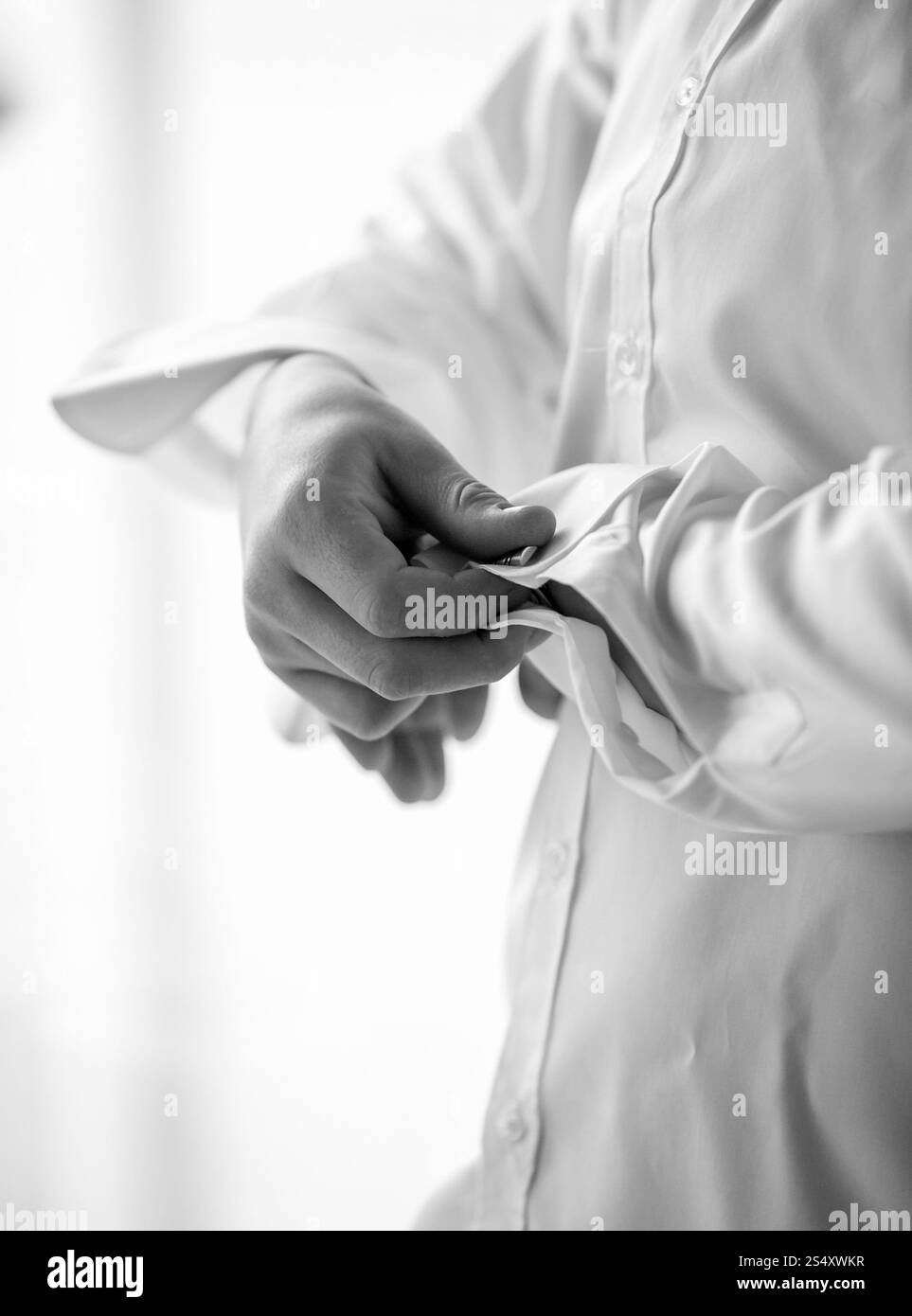 Businessman adjusting cufflinks on white hi-res stock photography and ...