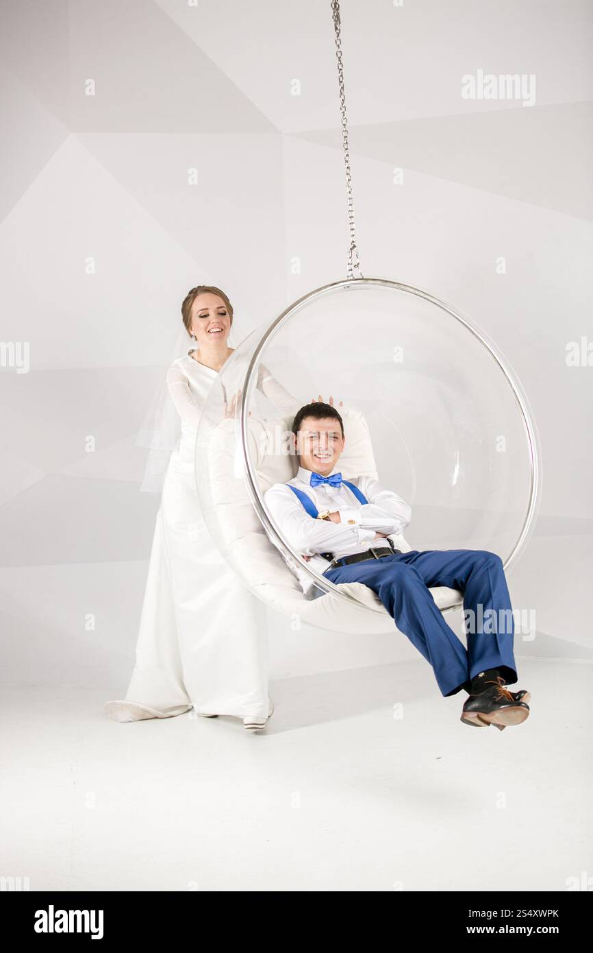 Young groom swinging beautiful happy hi-res stock photography and ...