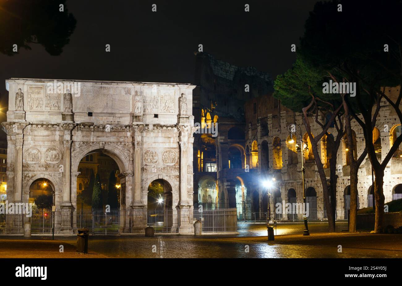 Colosseum and Constantine Arch night view in Rome, Italy Stock Photo ...
