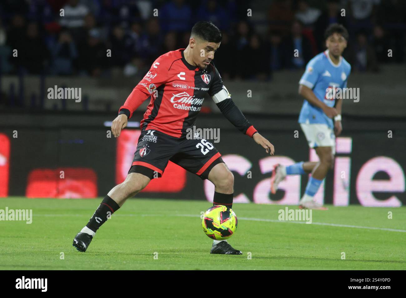 Aldo Rocha #26 of Atlas controls the ball against of Cruz Azul during ...
