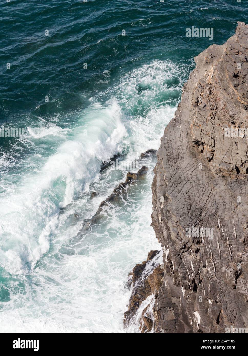 Waves breaking on rocky coast. View from above Stock Photo - Alamy