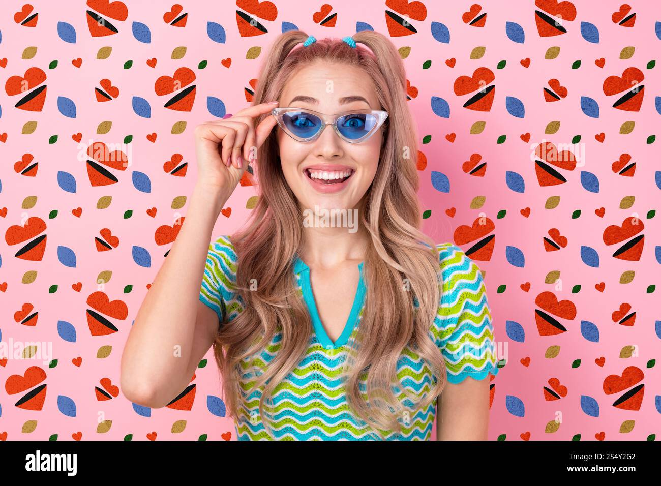 Portrait of impressed girl with tails dressed colorful suit touching ...