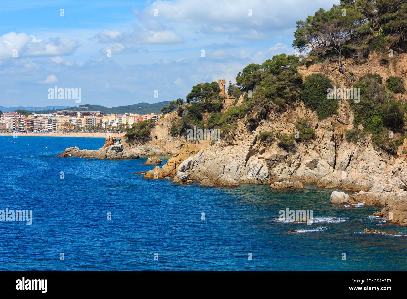 Summer sea rocky coast view with Castle of Sant Joan and Sa Caleta ...