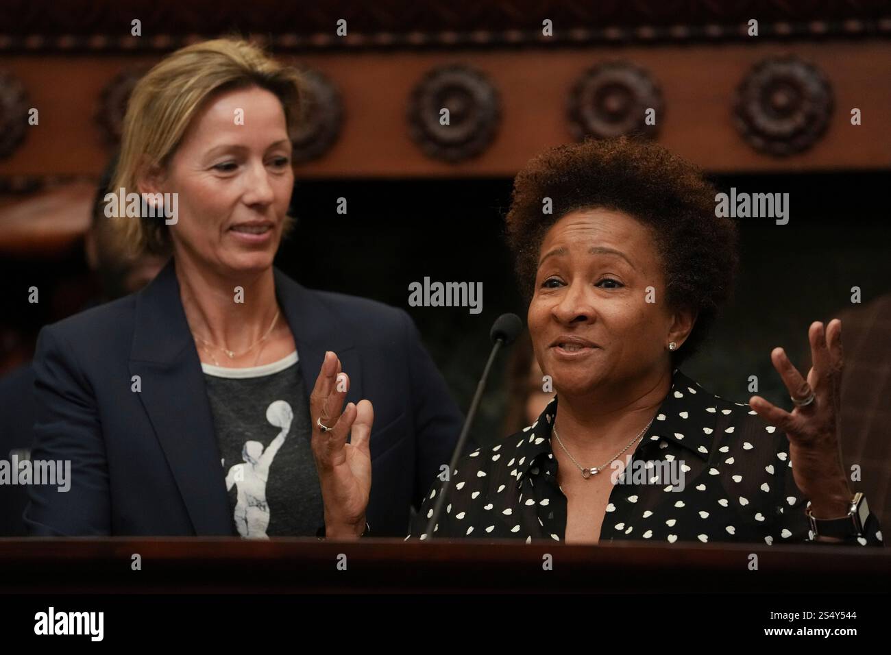 Wanda Sykes, right, accompanied by her wife Alex Sykes, speaks during a ...