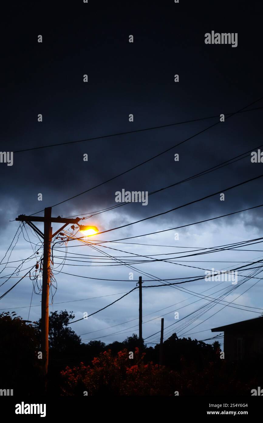 Street light at night with a stormy sky background. Dark mystery scene ...