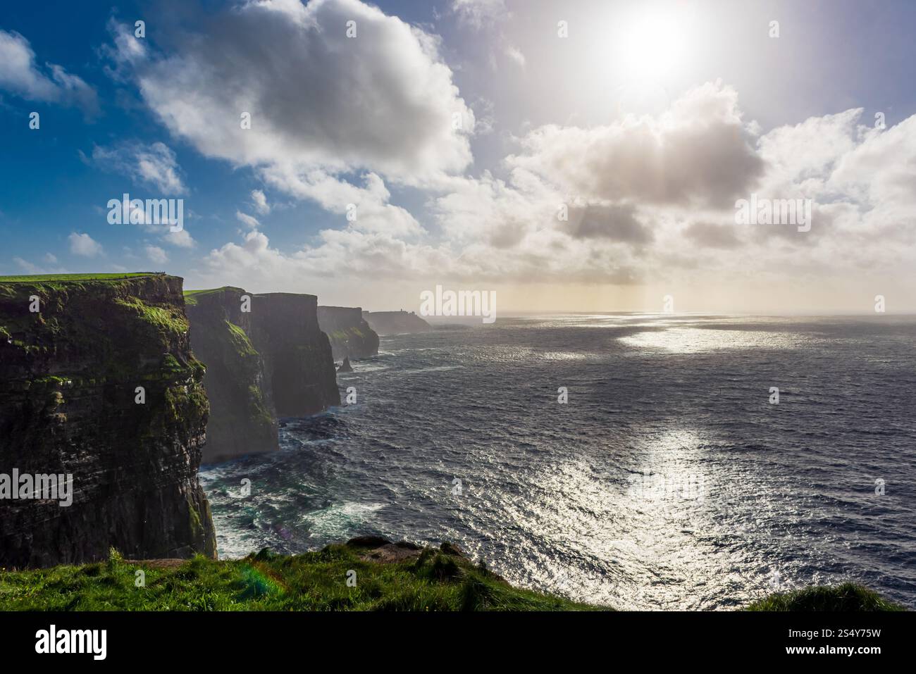 Cliffs of Moher, Ireland, by a sunny end of afternoon, sun beam visible ...