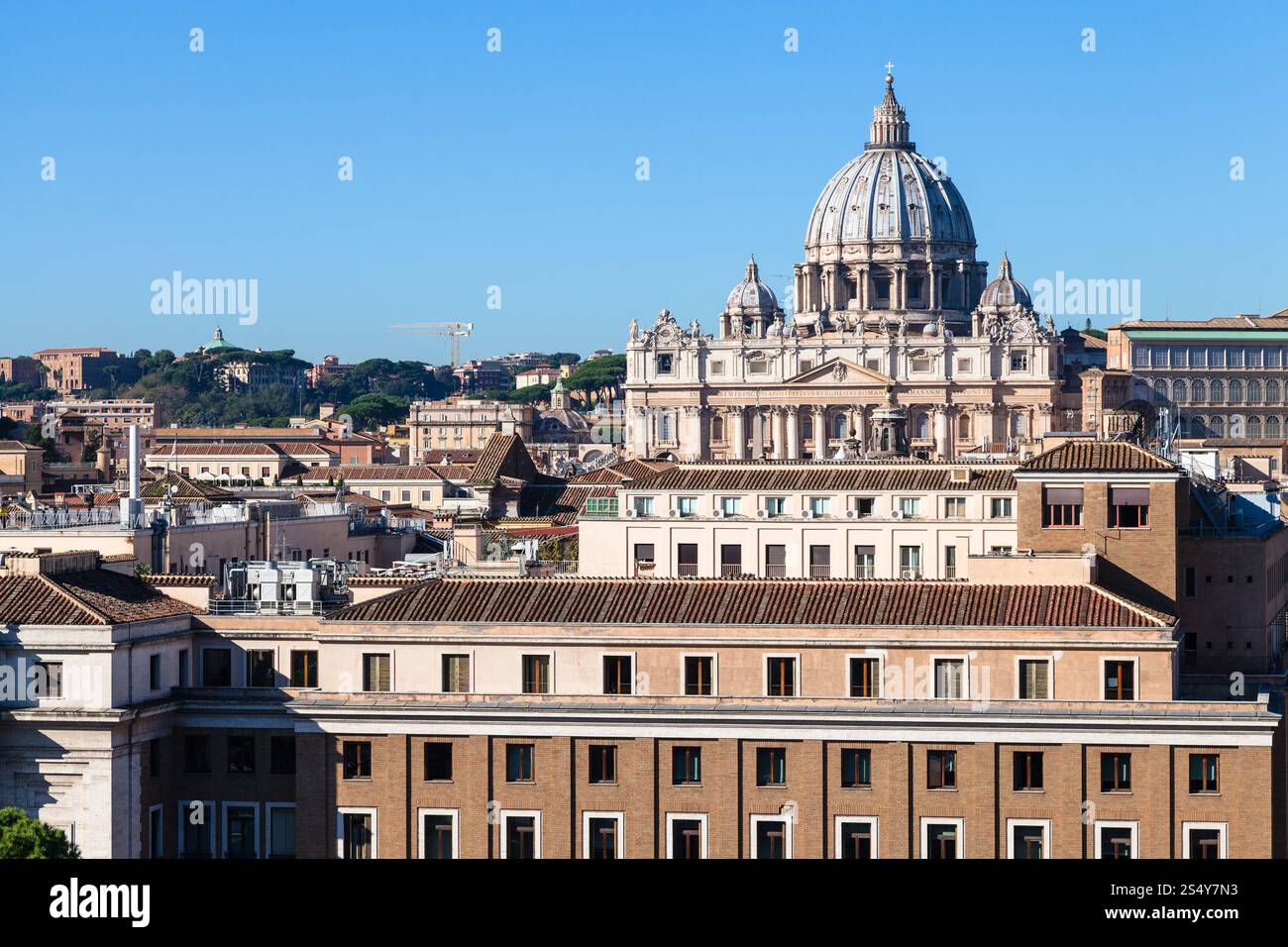 travel to Italy - view of St Peter's Basilica in Vatican city and houses in Borgo district in ...