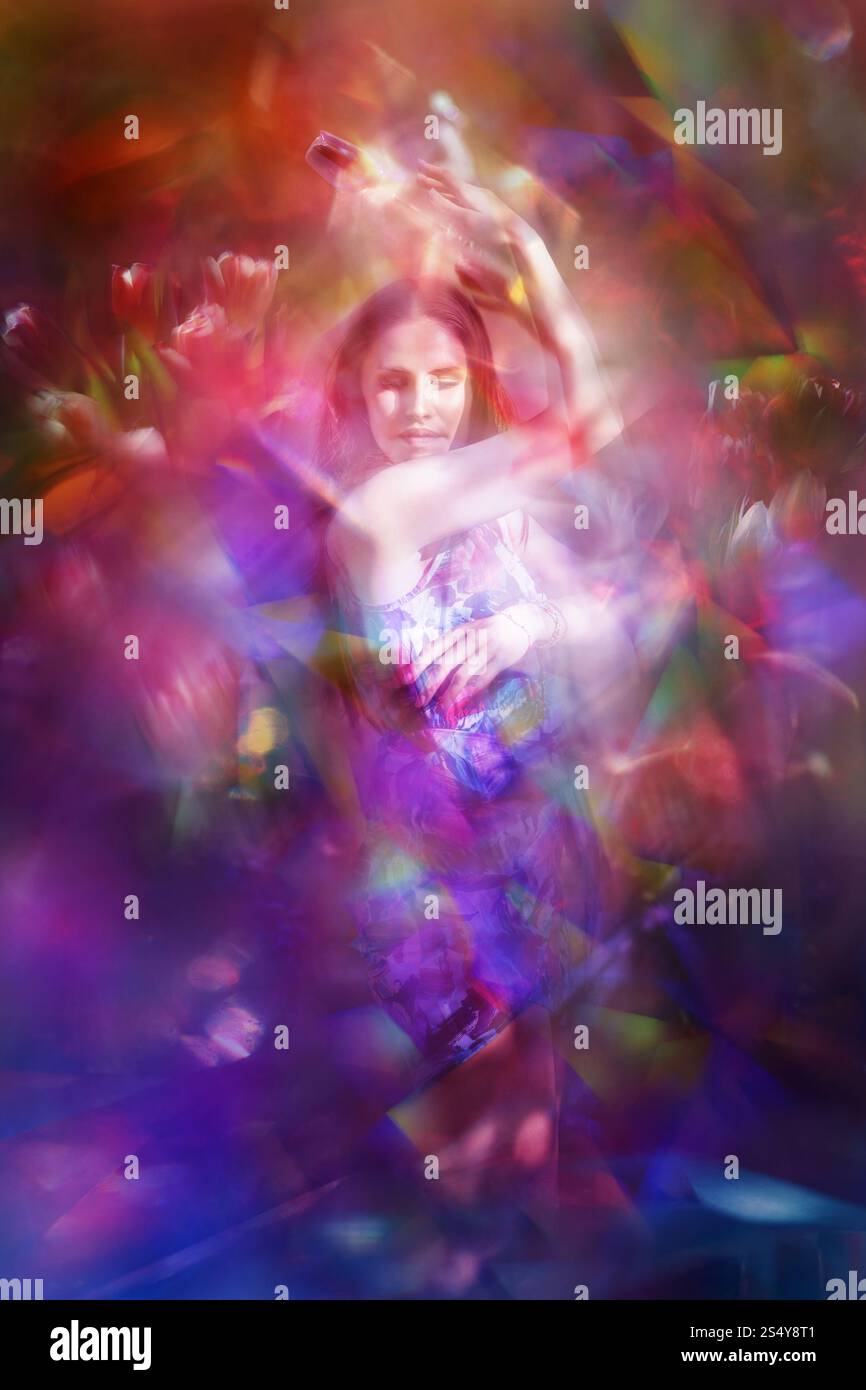 An expressively posing beautiful woman with a floating crystal Tulip ...