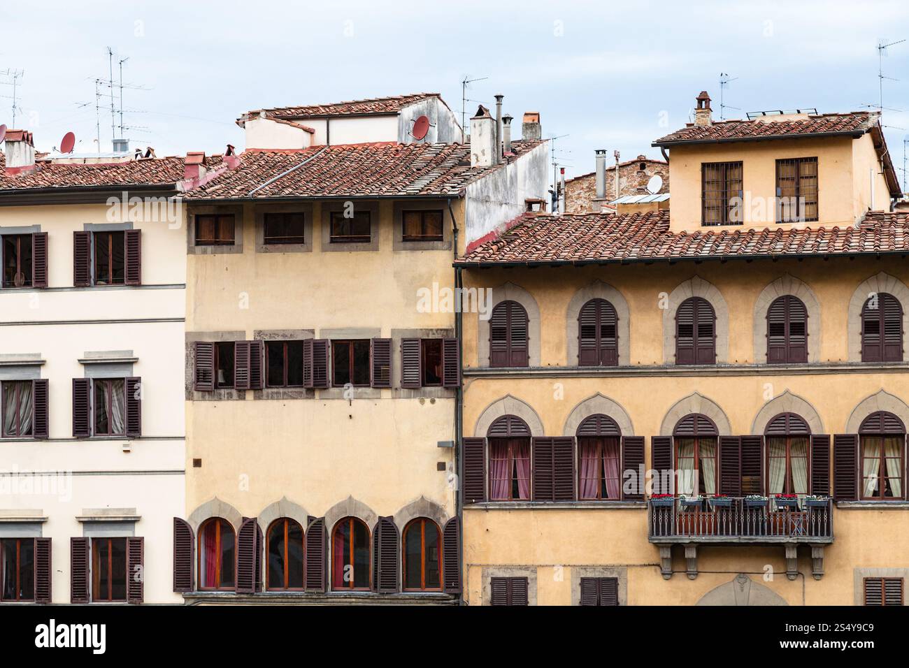 travel to Italy - front view of various medieval houses in Florence ...
