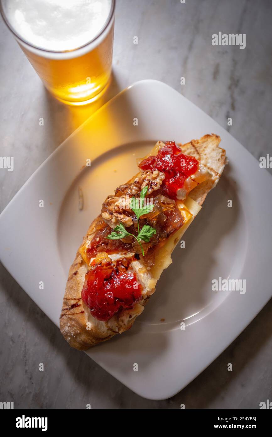 A Pincho with Beer ready to eat, top view. The Pincho is a typical ...