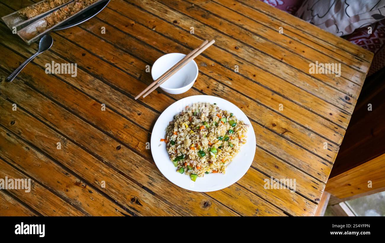 travel to China - above view of fried rice with vegetables on plate in ...