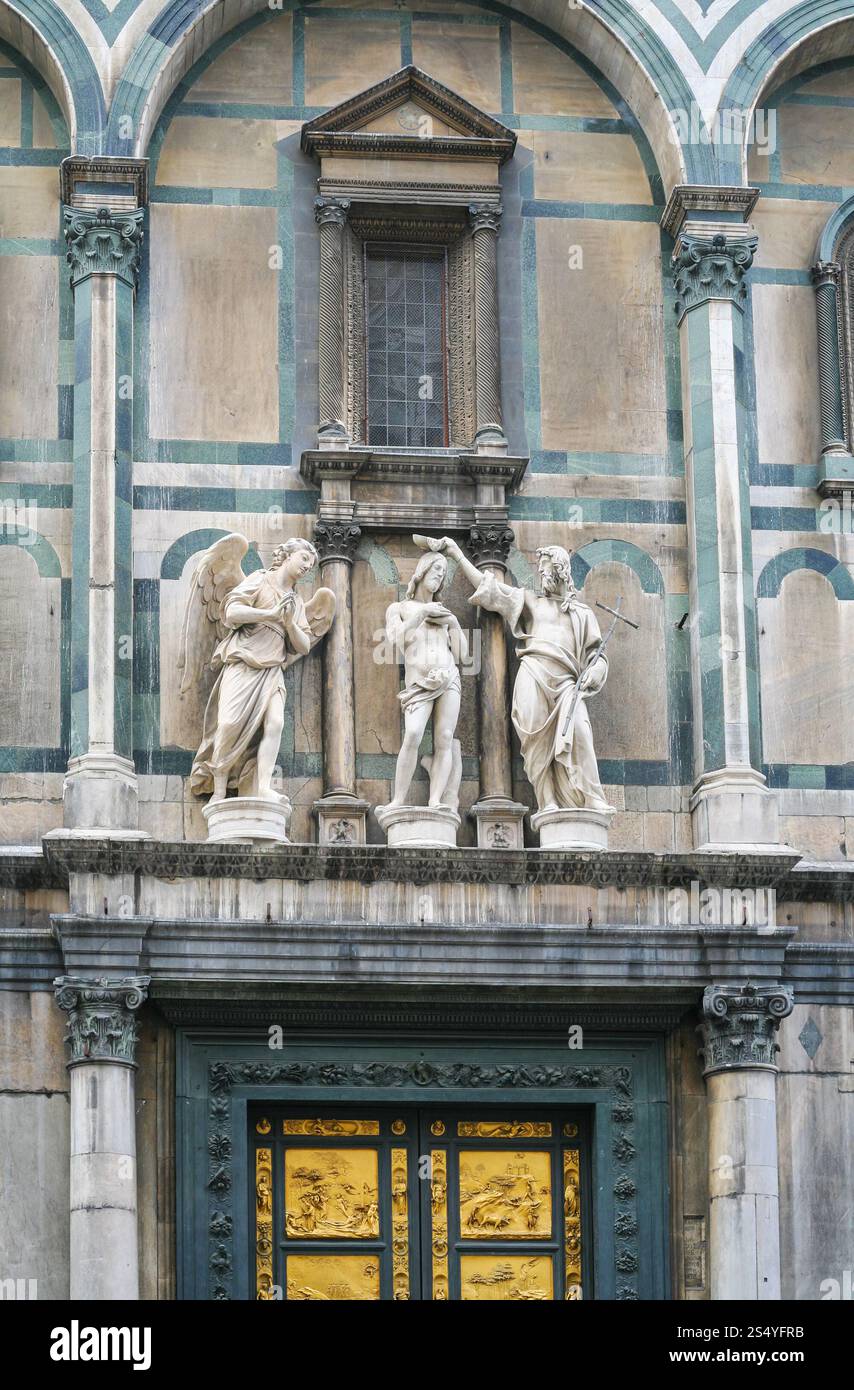 travel to Italy - statues over doors of Battistero di San Giovanni ...