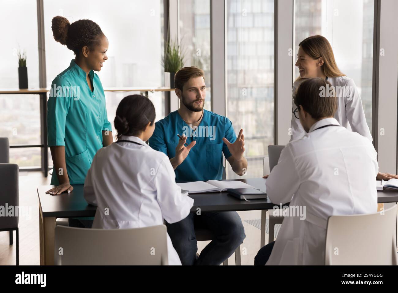 Doctors gathered together engaged in healthcare concilium Stock Photo ...