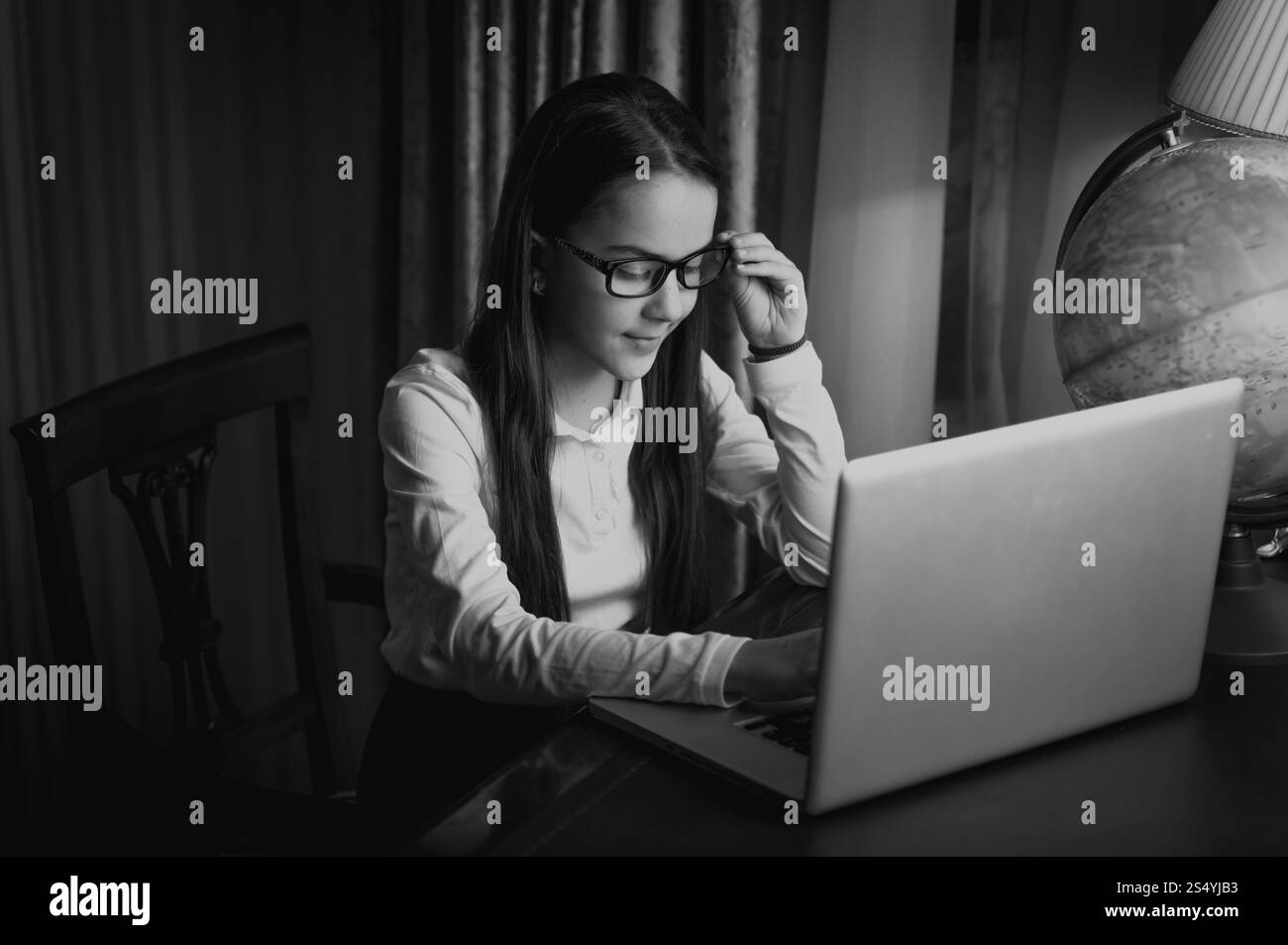 Black and white image of beautiful schoolgirl wearing eyeglasses posing ...