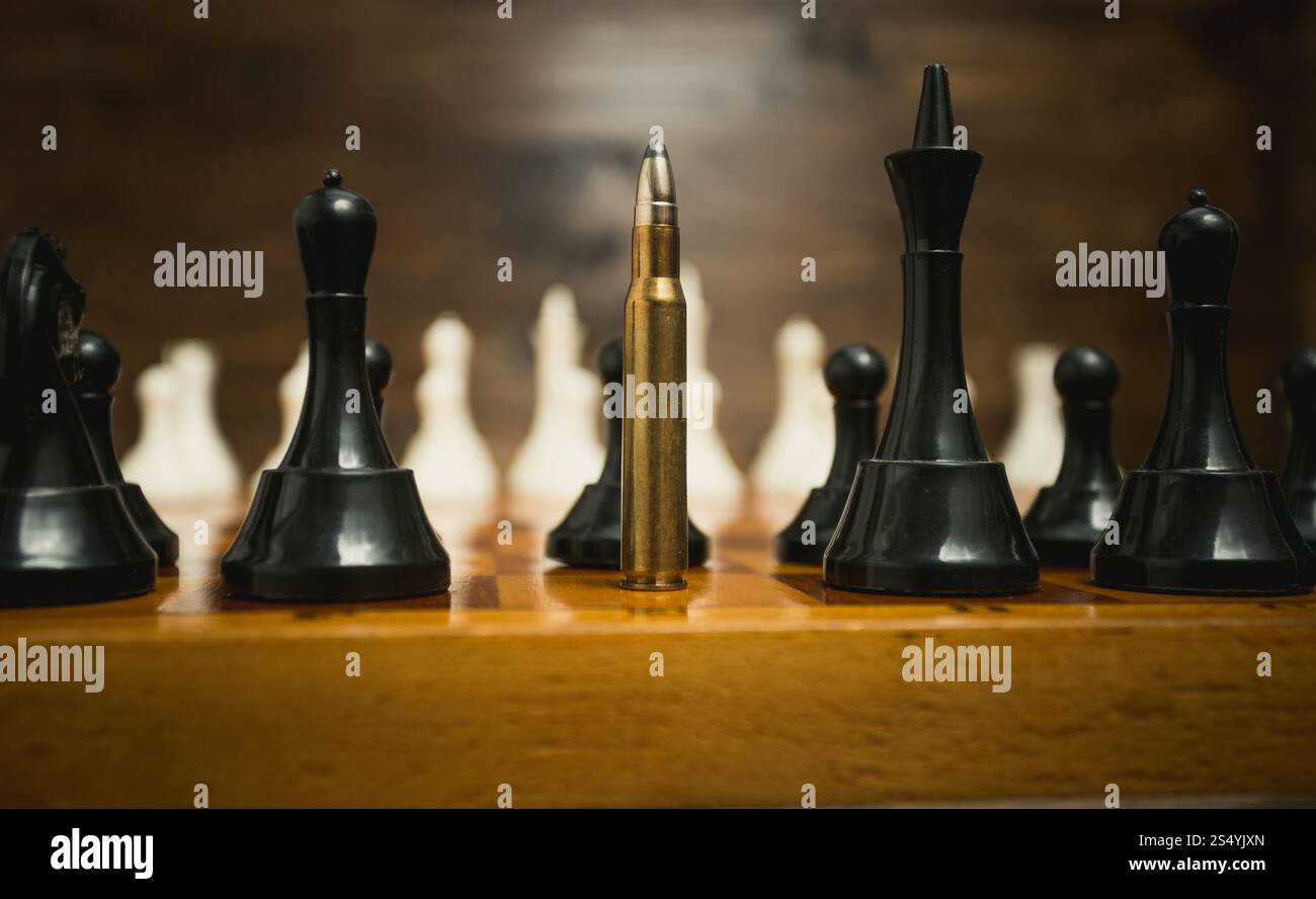 Big riffle bullet among chess pieces. Concept of weapon power Stock ...