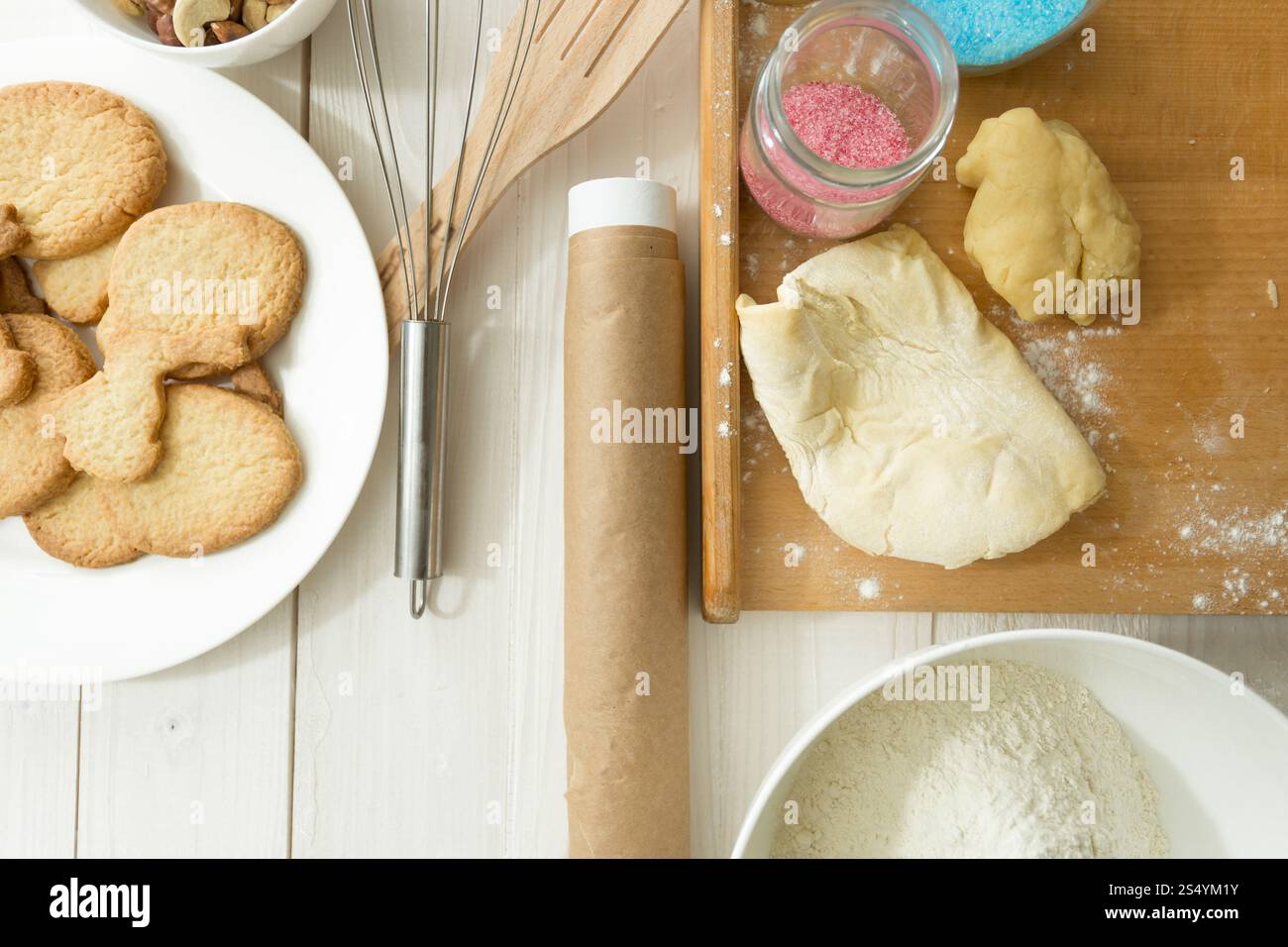 Closeup photo of freshly baked cooking next to kitchen utensils on ...
