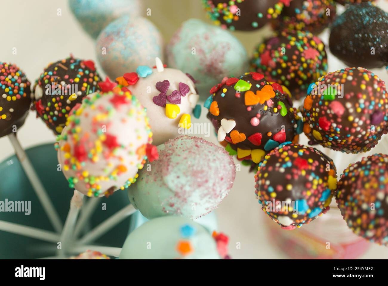 Beautiful cake pops and candies decorated with sprinkles Stock Photo ...