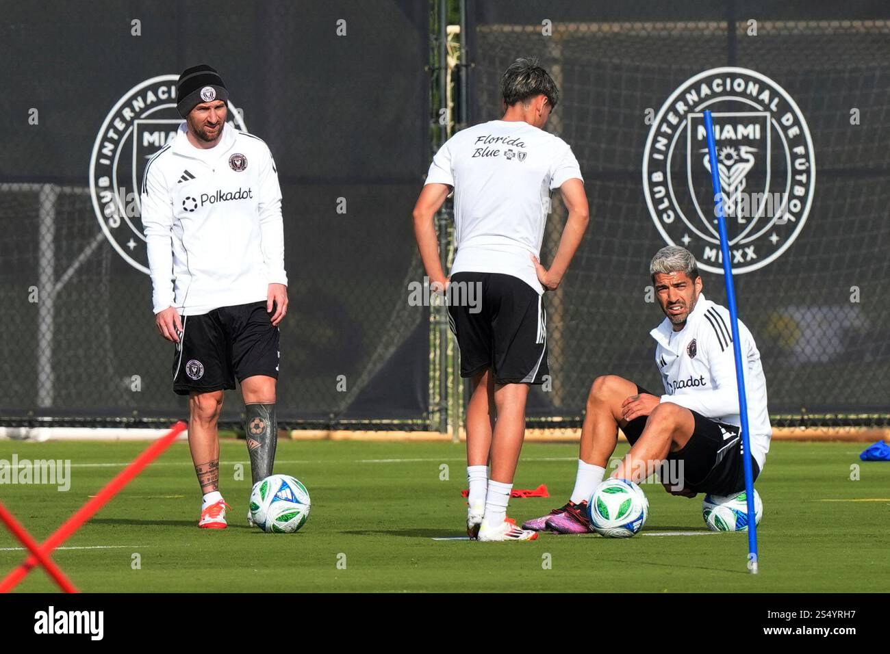 Inter Miami forwards Lionel Messi, left and Luis Suarez, right, take a ...