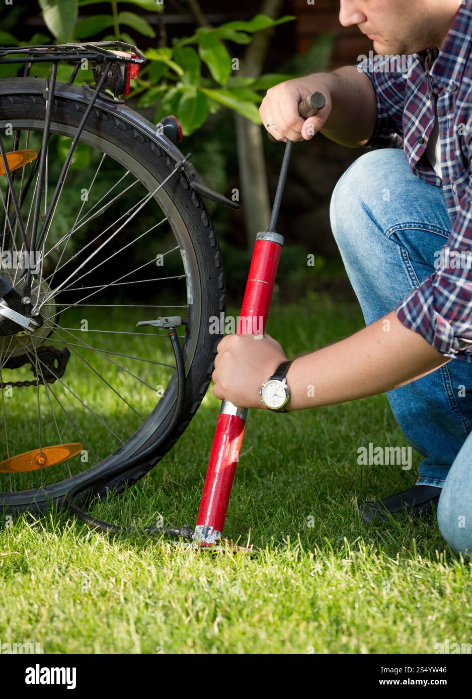Man pumping wheel bike hi-res stock photography and images - Alamy