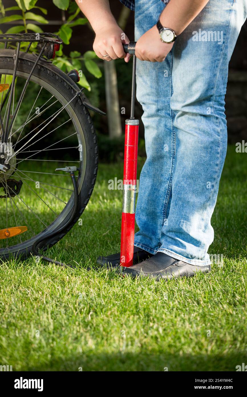 Man pumping wheel bike hi-res stock photography and images - Alamy