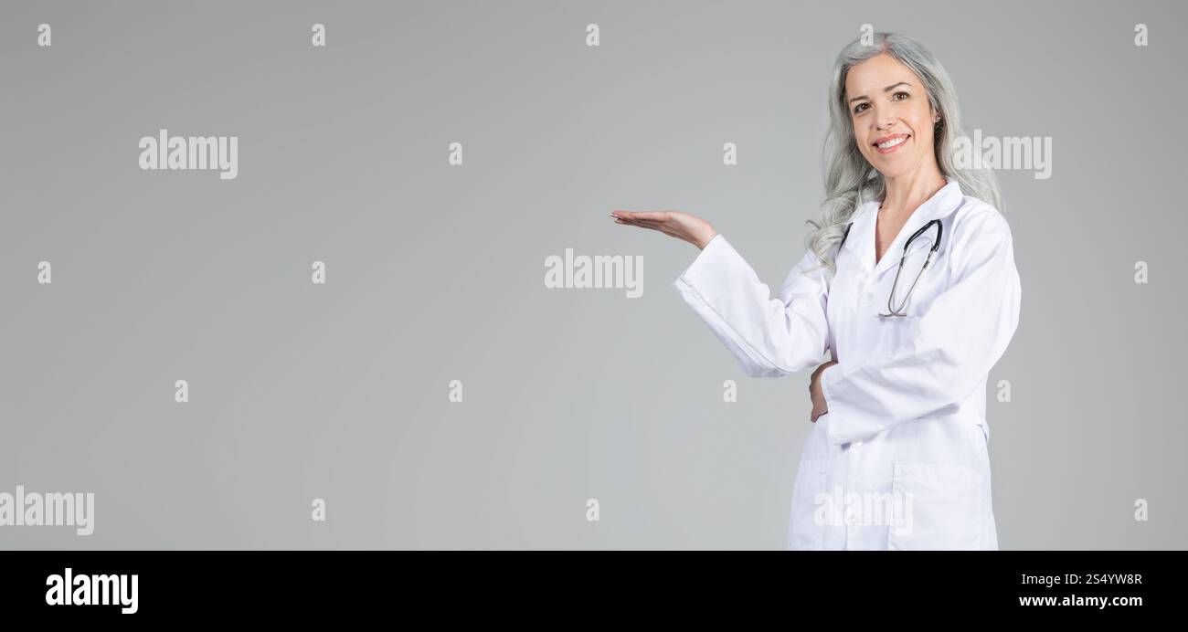 Middle aged lady doctor discusses healthcare options on a neutral ...