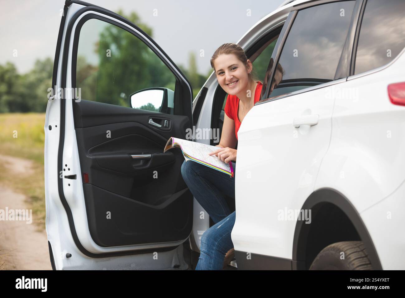 Female driver got lost and looking for the route in map Stock Photo - Alamy