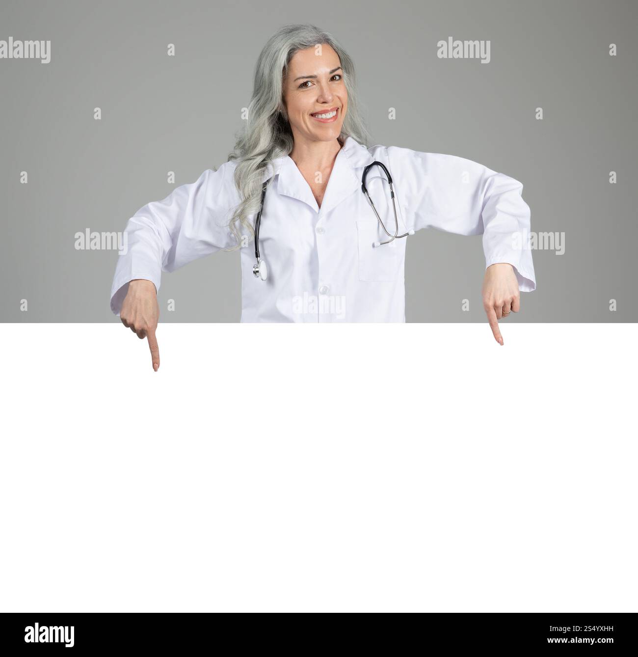 Healthcare professional gestures positively while presenting ...