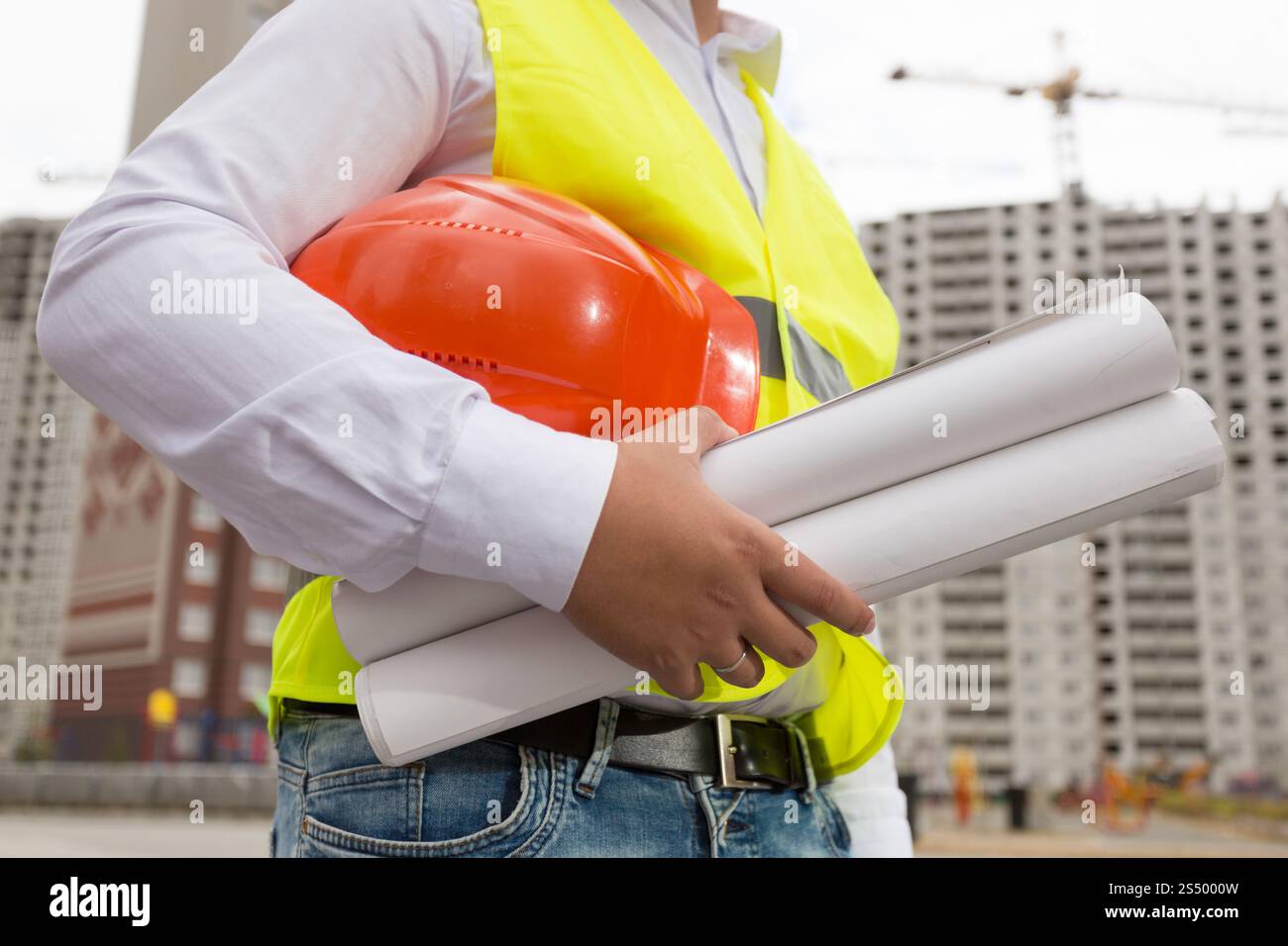 Closeup photo of young architect posing at building site Stock Photo ...