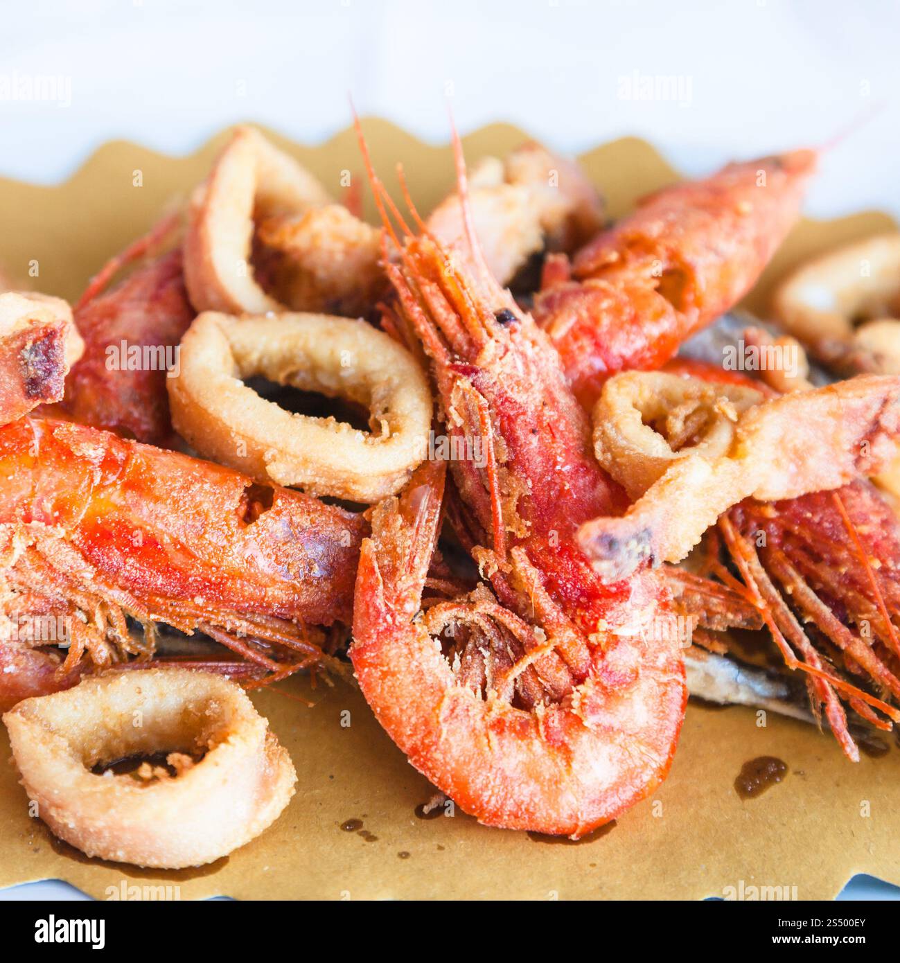 typical italian food - fried local seafood on plate close up in ...